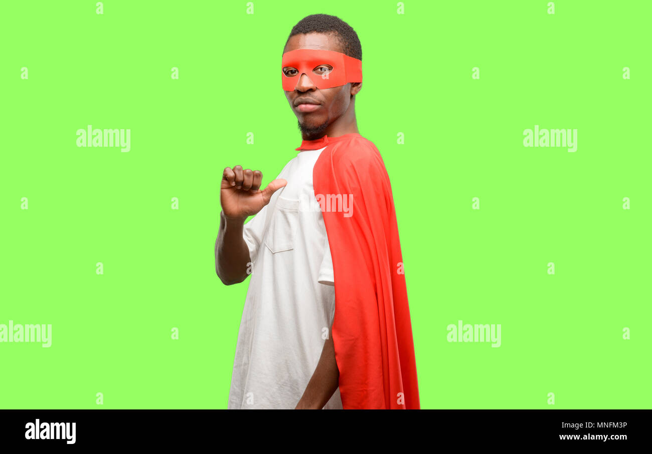 African black super hero man proud, excited and arrogant, pointing with ...