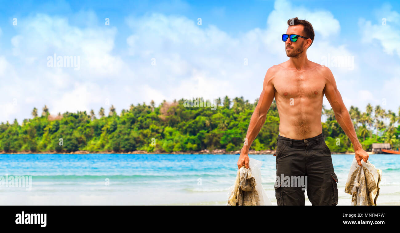 People clean beach on nature background Stock Photo - Alamy