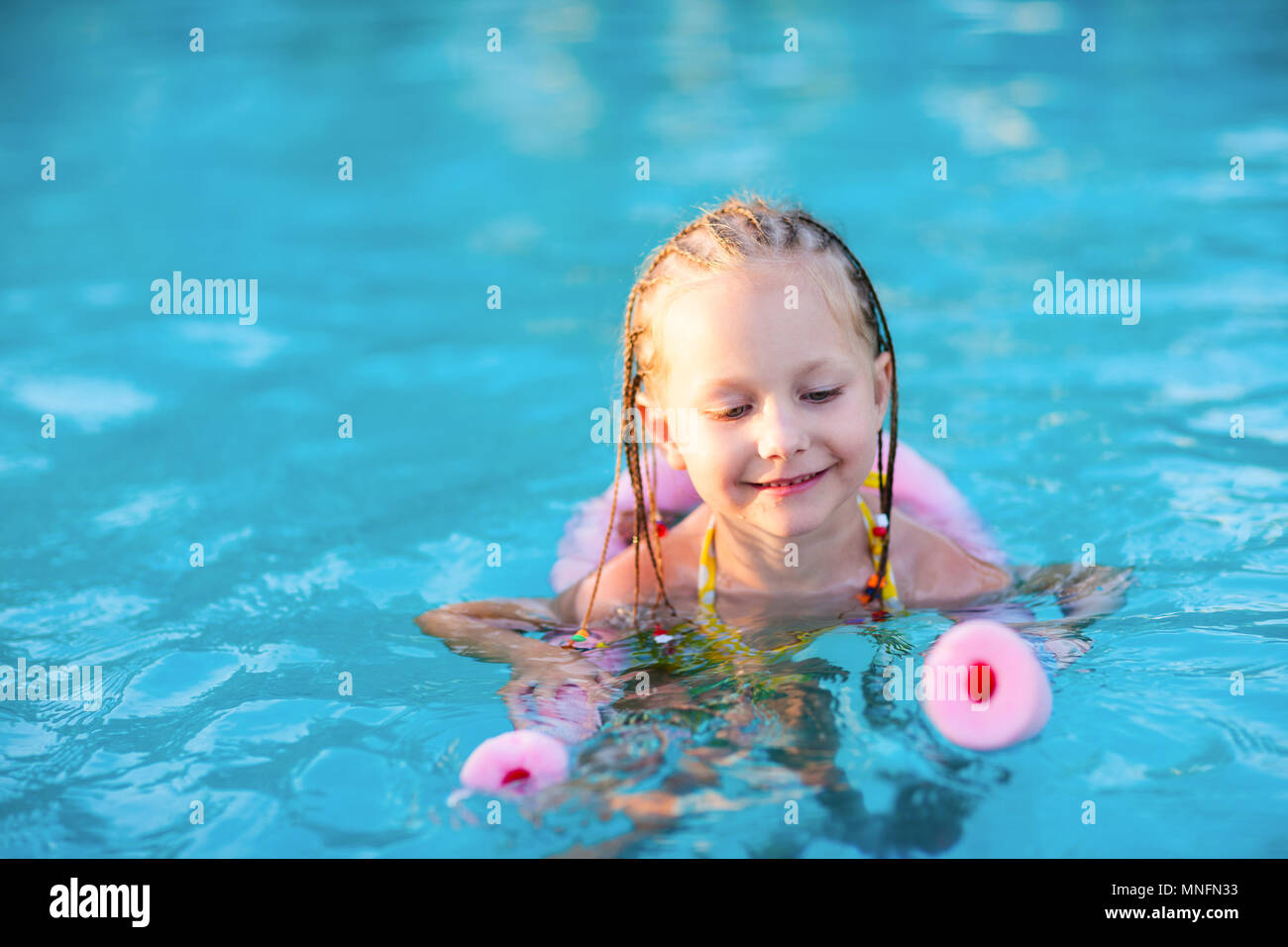 Pink pool noodle floating in hi-res stock photography and images - Alamy