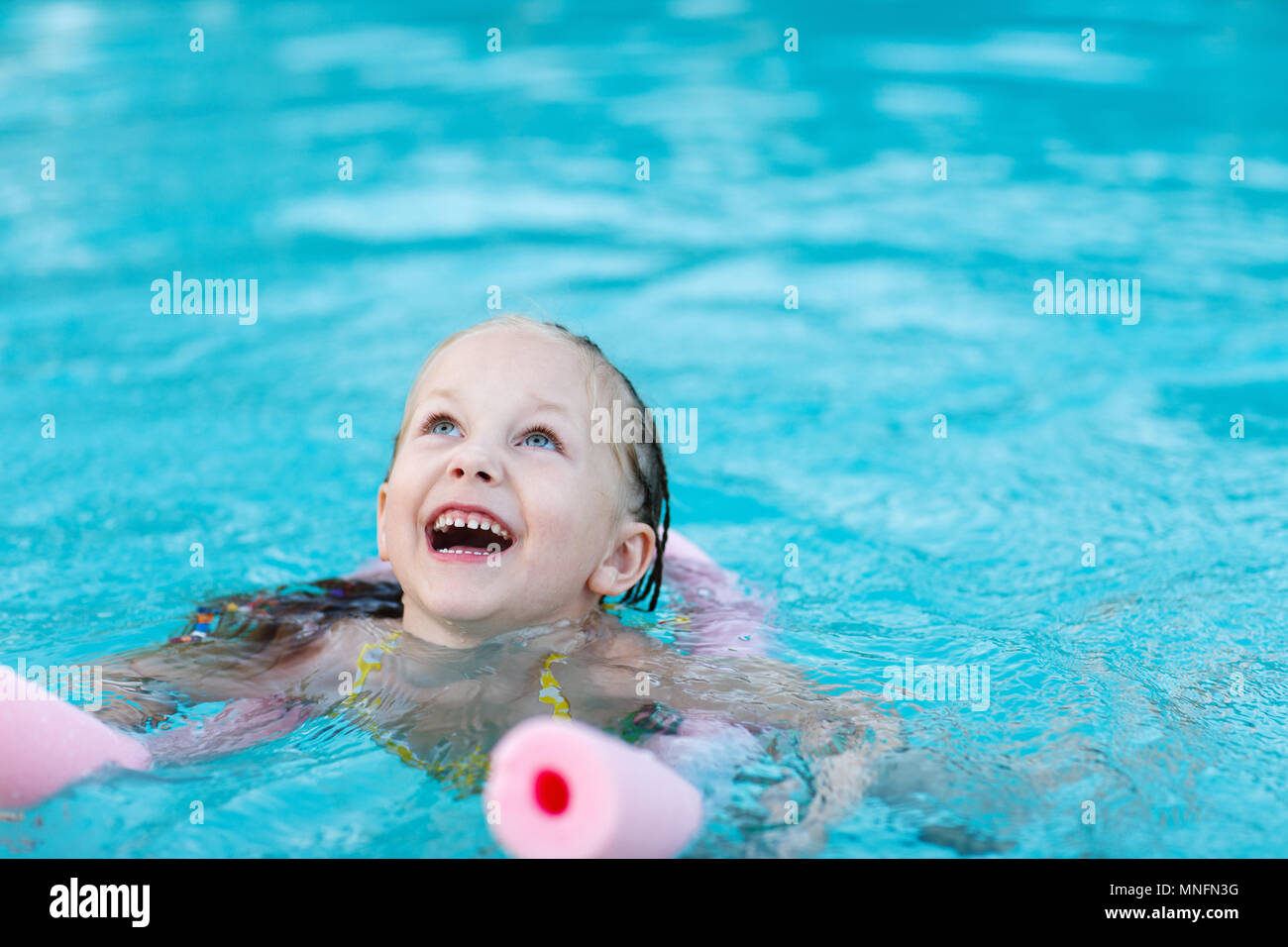 Pink pool noodle floating in hi-res stock photography and images - Alamy