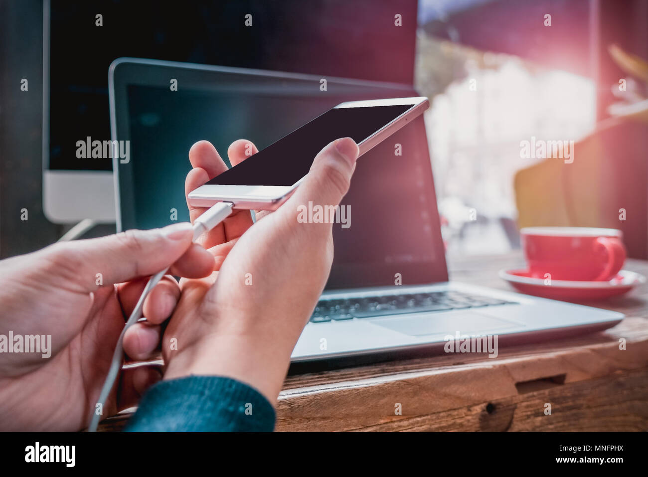 Woman plugging computer hi-res stock photography and images - Alamy