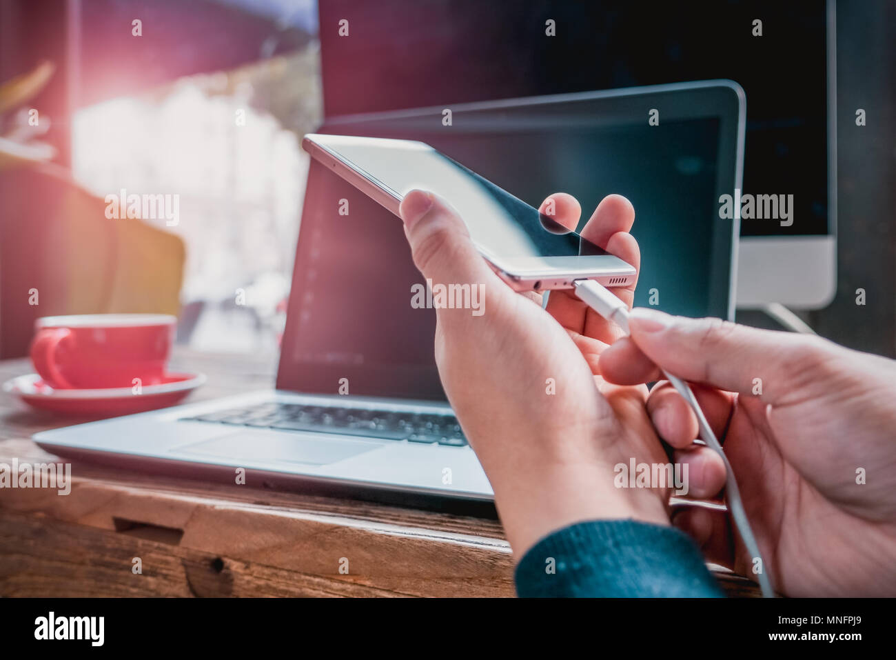 Woman plugging computer hi-res stock photography and images - Alamy