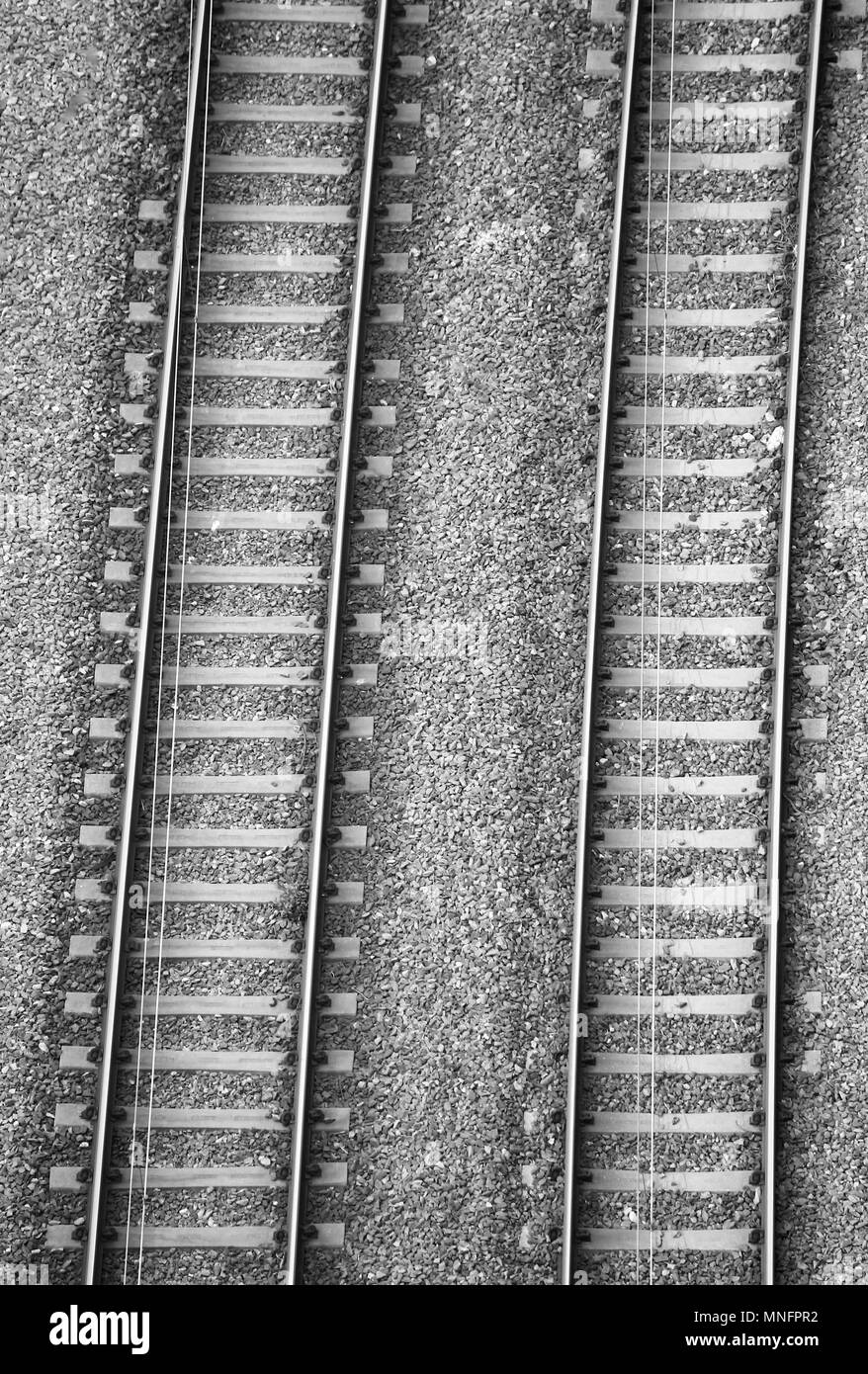 Train tracks seen from above and photographed in black and white Stock ...