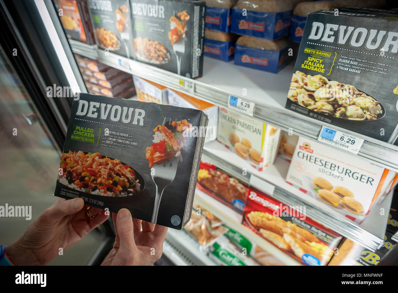 A shopper chooses a package of Kraft Heinz' Devour brand frozen meal in ...