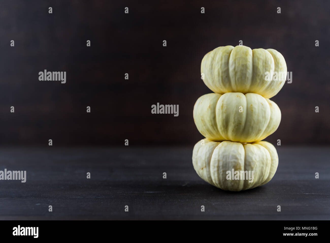 Three Baby Boo Pumpkins and Copy Space to left Stock Photo - Alamy