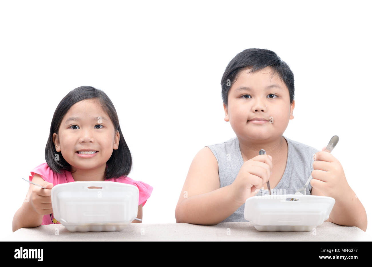 Brother and sister eating fried rice in foam box isolated on white ...