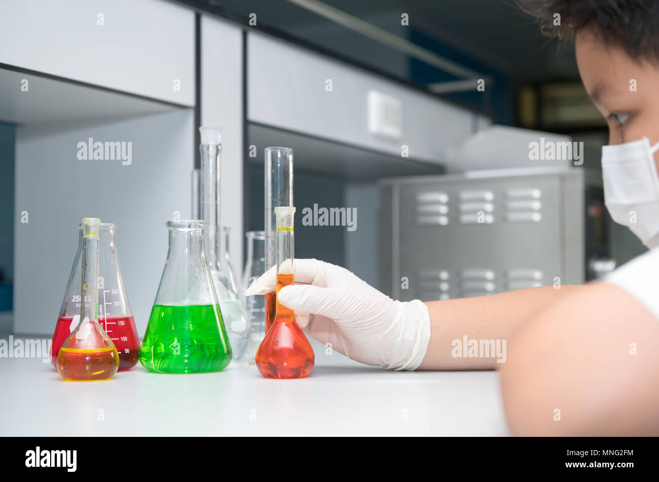 kid scientist making experiment with test tube in chemical laboratory ...