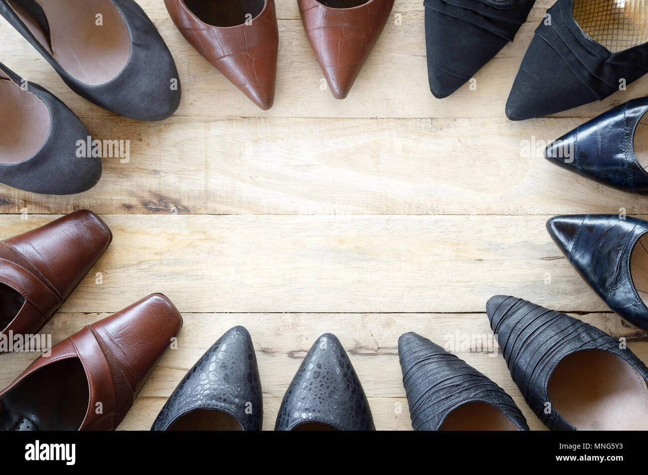 top view of different woman shoe on wooden background, several types of ...