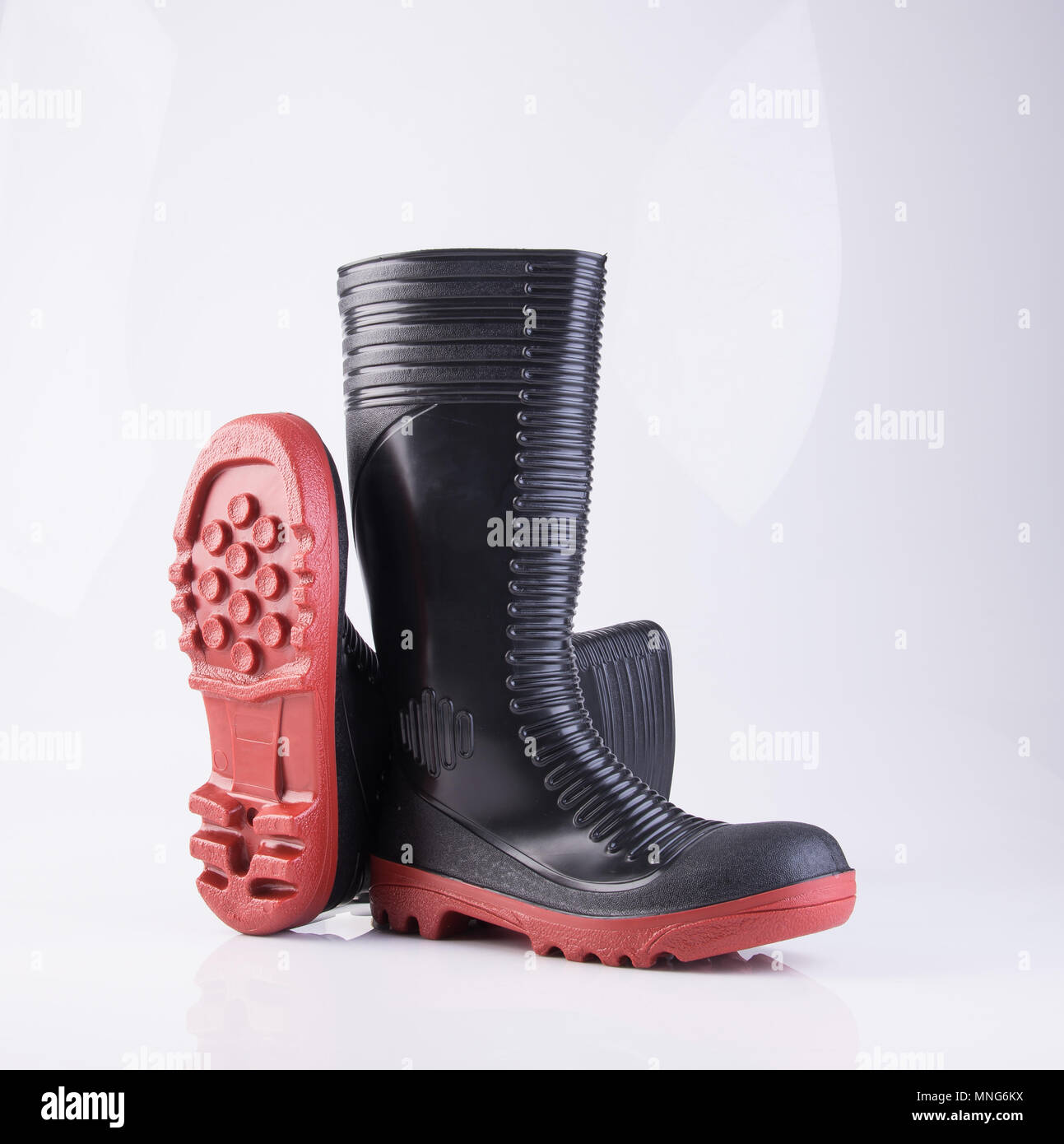 shoe or black color rubber boots on a background Stock Photo - Alamy