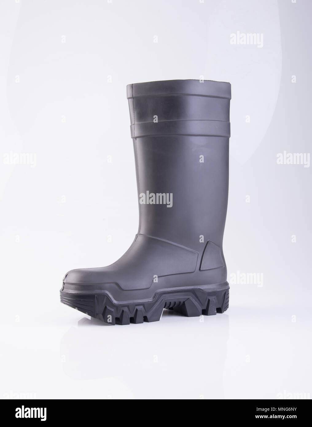 shoe or black color rubber boots on a background Stock Photo - Alamy
