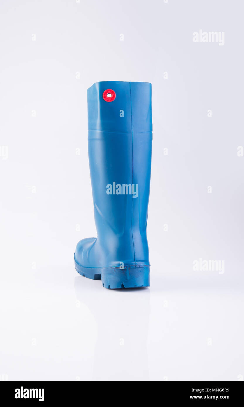 shoe or blue color rubber boots on a background Stock Photo - Alamy