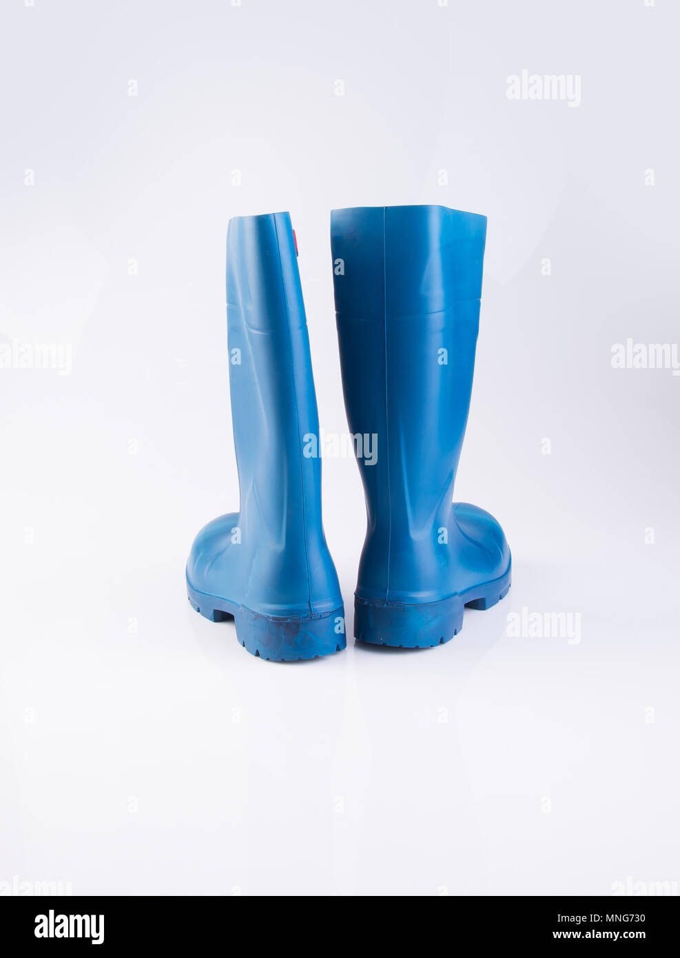 shoe or blue color rubber boots on a background Stock Photo - Alamy