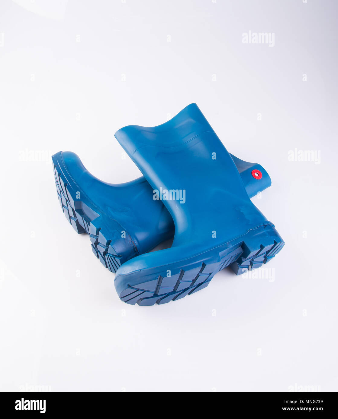 shoe or blue color rubber boots on a background Stock Photo - Alamy