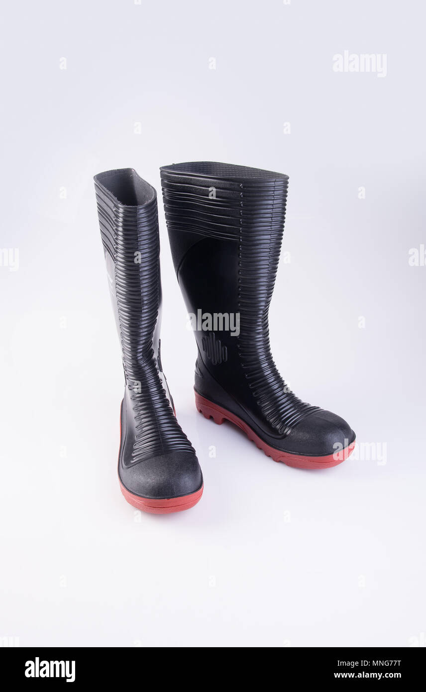 shoe or black color rubber boots on a background Stock Photo - Alamy