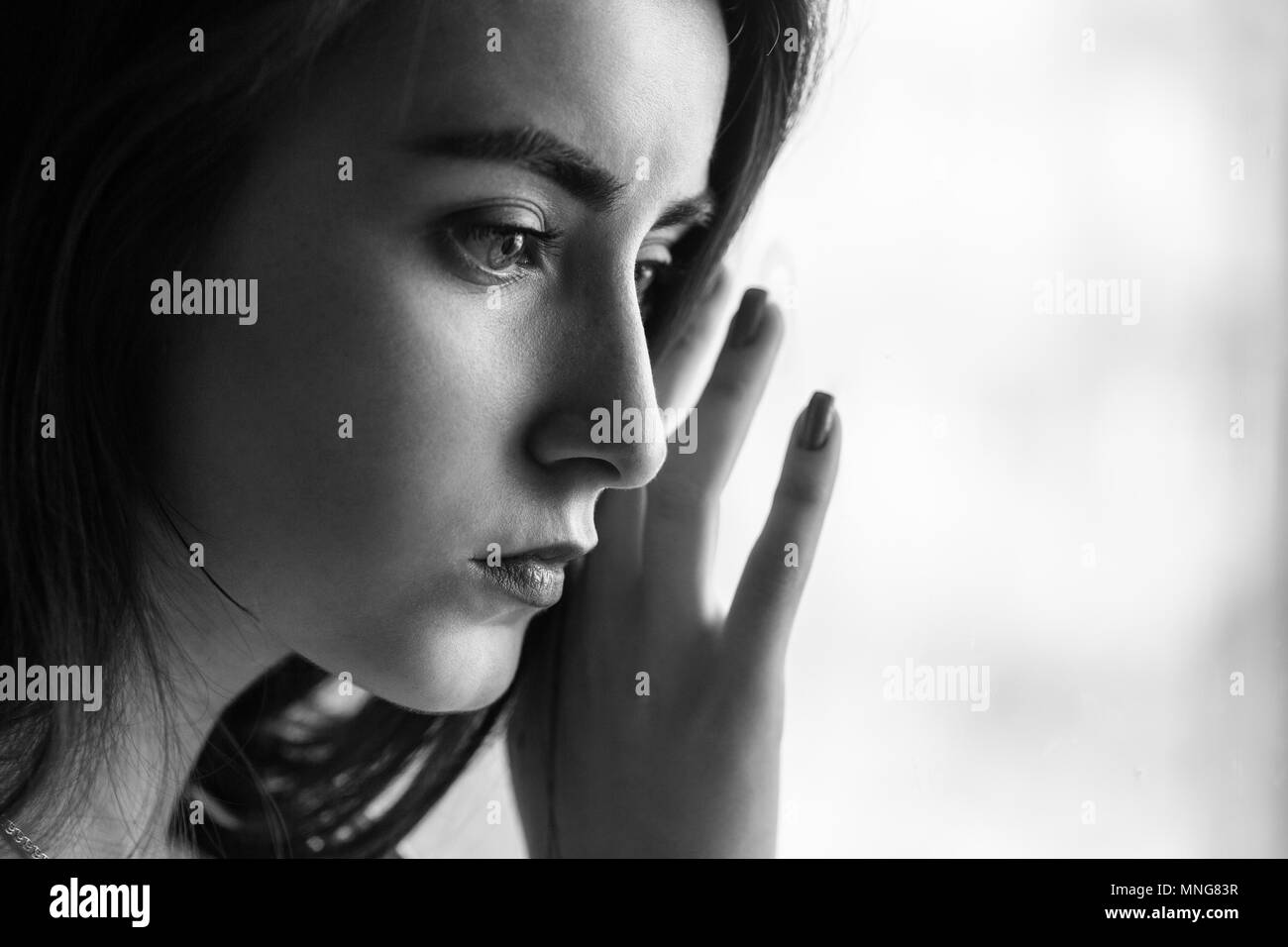 sensual sad closeup female portrait near window, monochrome Stock Photo ...