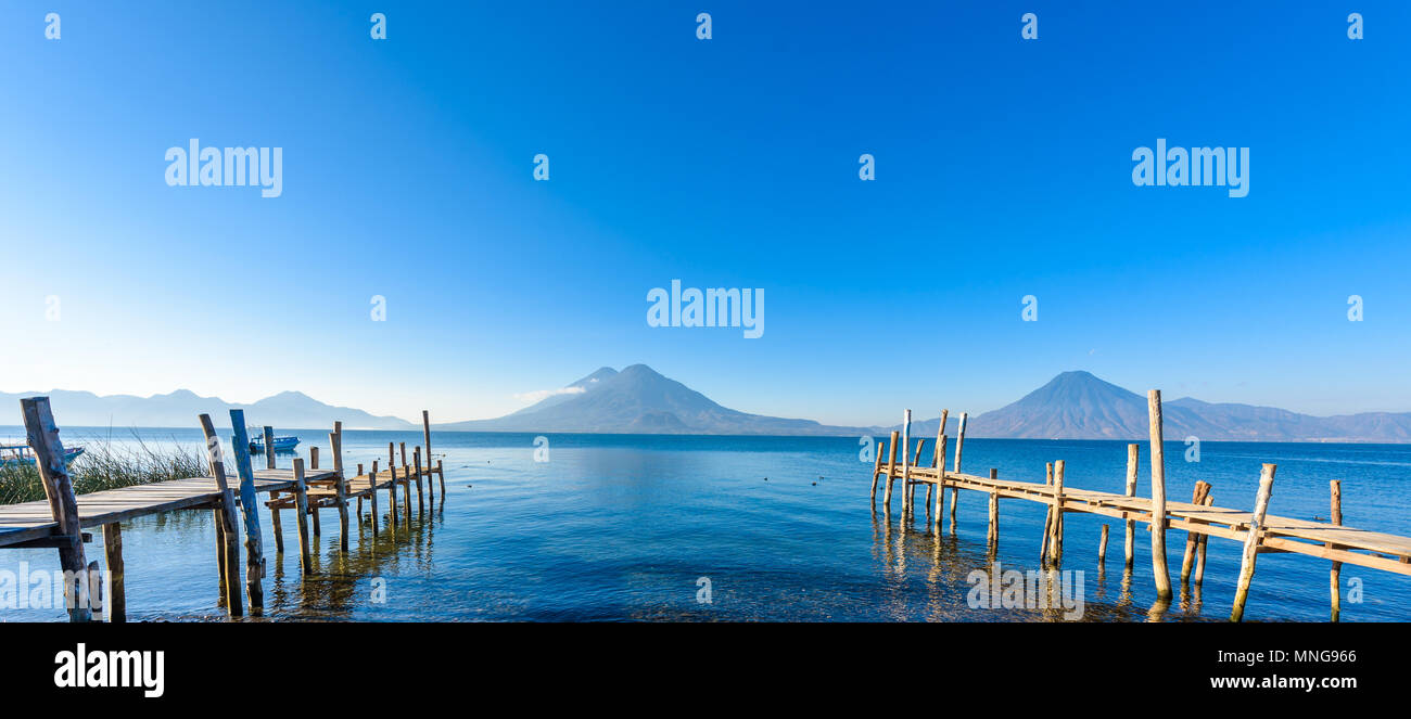 Wooden pier at Lake Atitlan on the beach in Panajachel, Guatemala. With ...