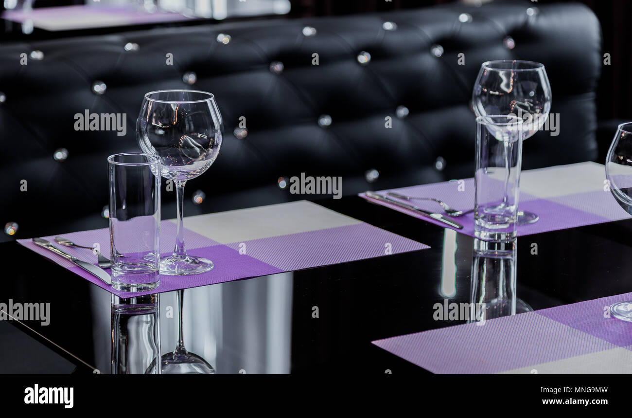 Table service in the restaurant. Transparent clean glasses and wine ...