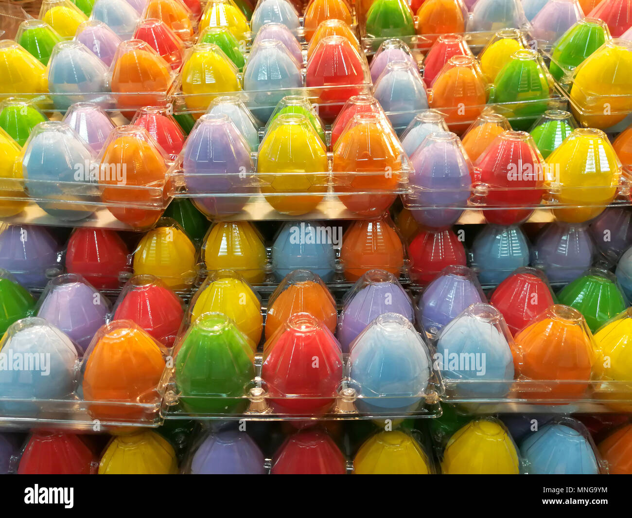 Colorful eggs in packaging for sale Stock Photo - Alamy