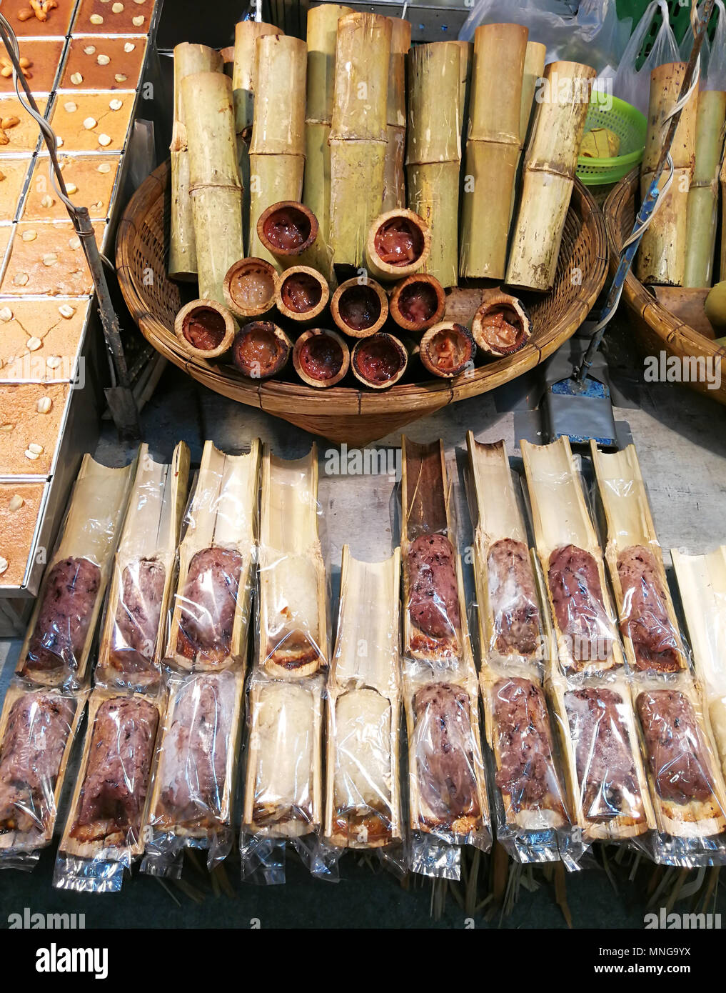 Sticky rice in bamboo cylinder put up for sale Stock Photo - Alamy