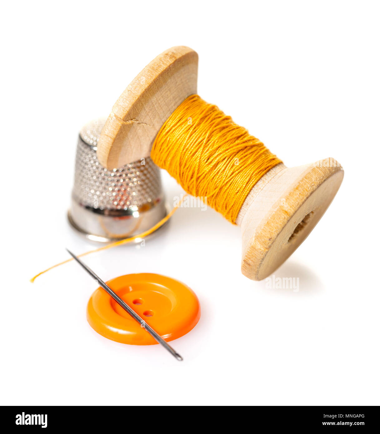 spool of thread and buttons on white isolated background Stock Photo ...