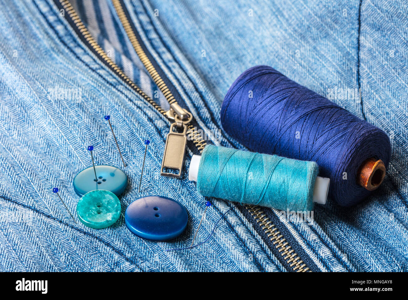 blue threads with buttons on the background of a denim jacket Stock ...