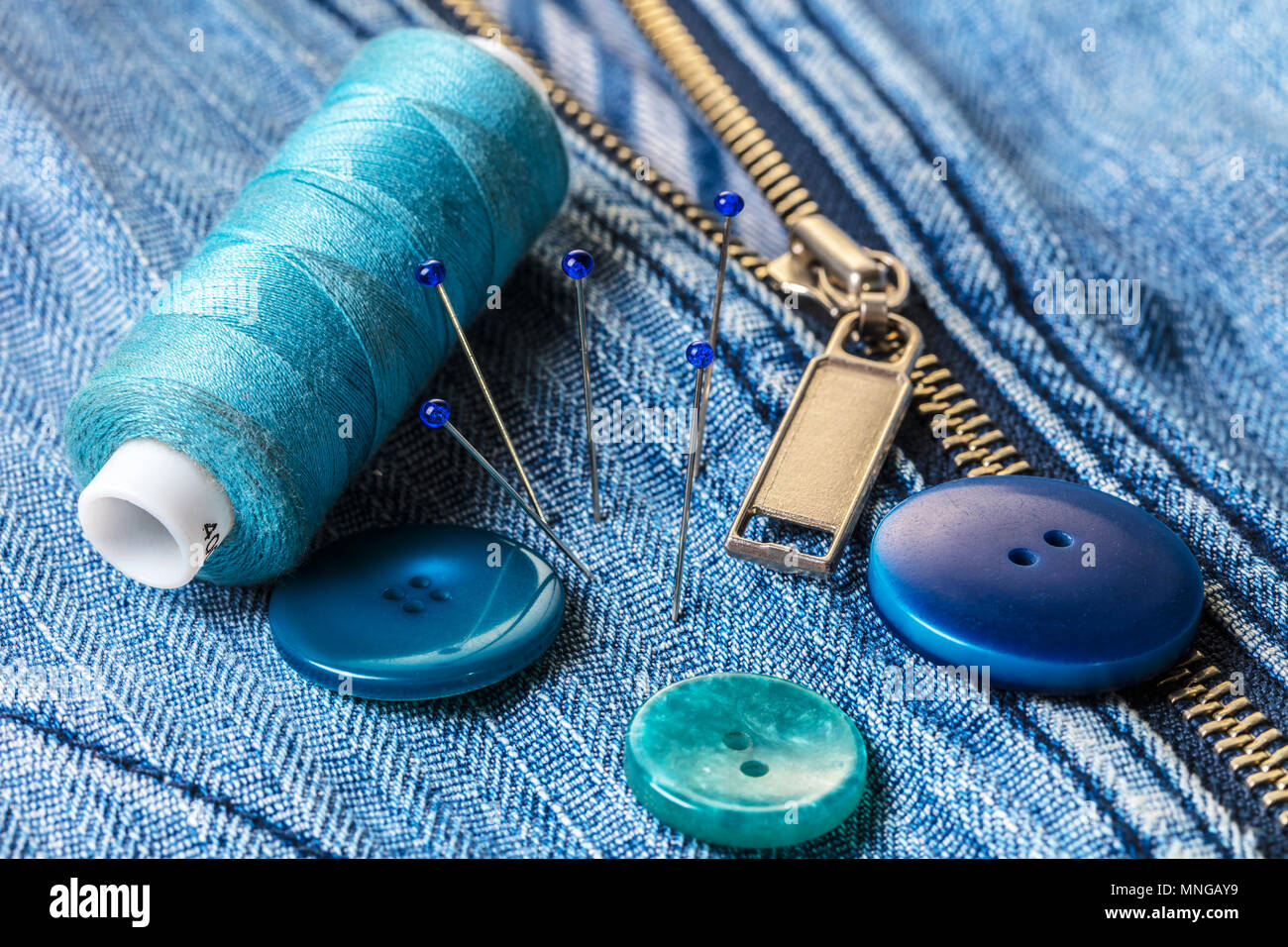 blue threads with buttons on the background of a denim jacket Stock ...