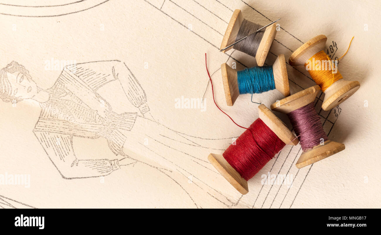 coils of colored threads on a background of paper pattern Stock Photo ...