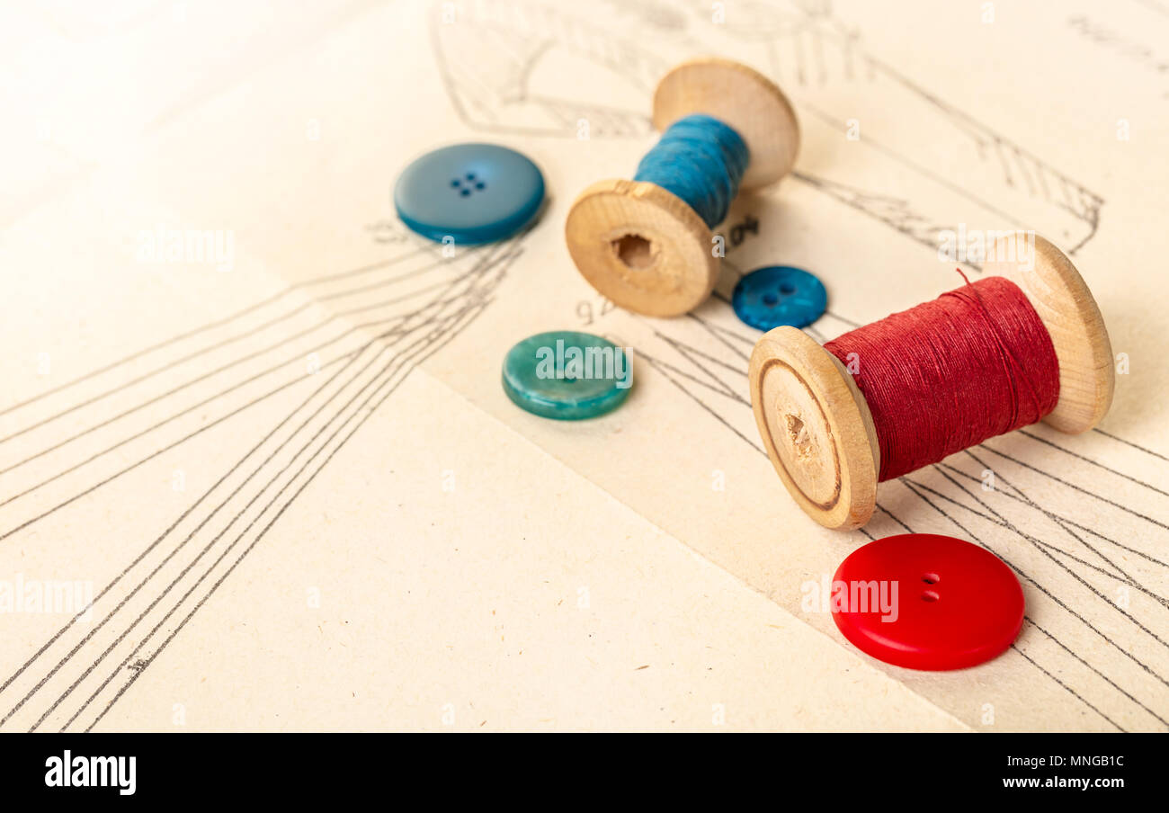 coils of colored threads on a background of paper pattern Stock Photo ...