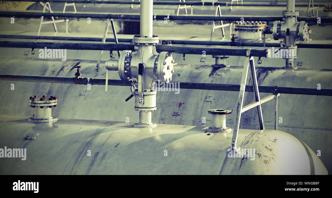 gas tank in a refinery factory construction and storage of gas with old ...