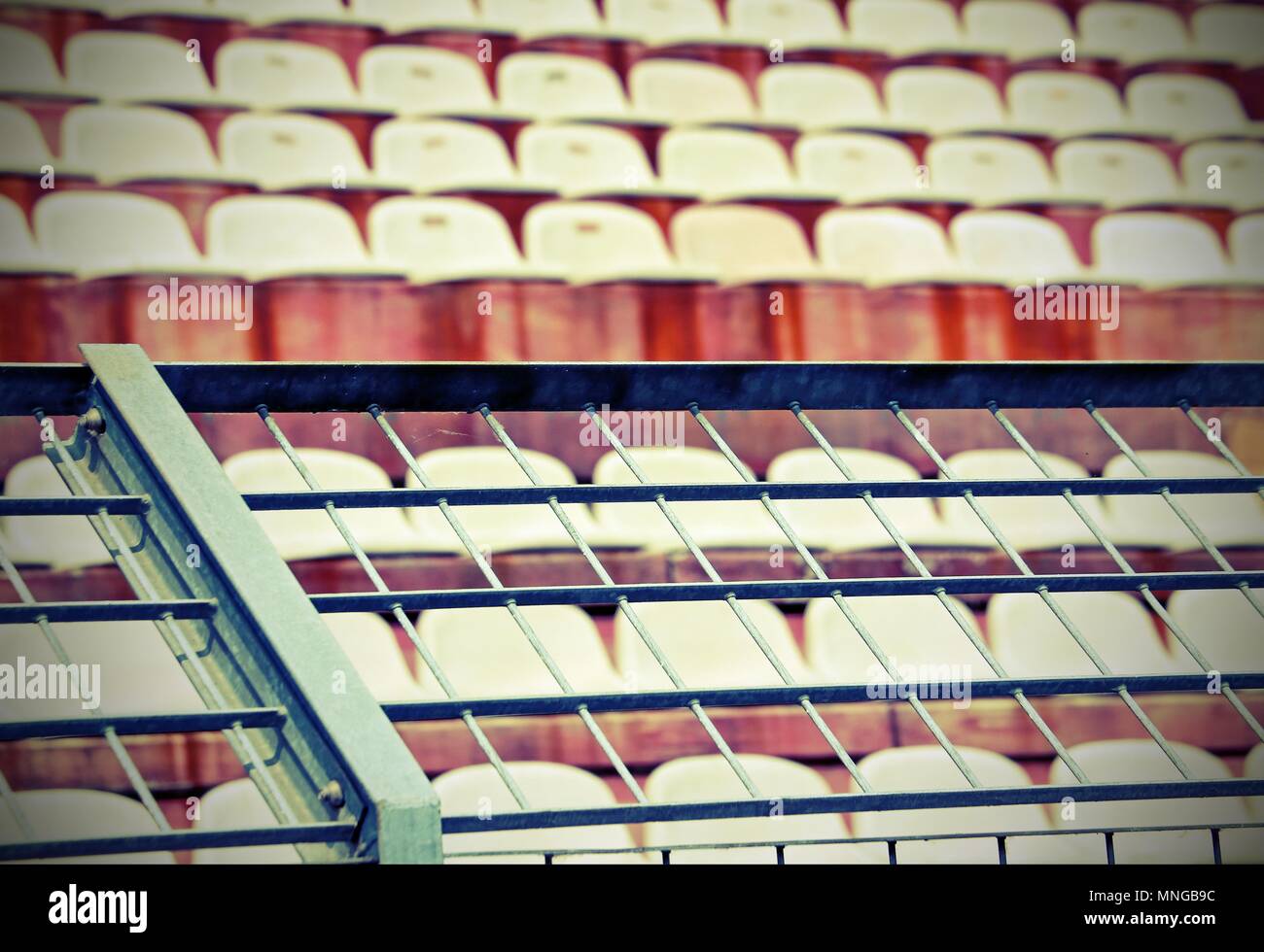 metal mesh in the stadium to divide the fans on the stairs from the ...