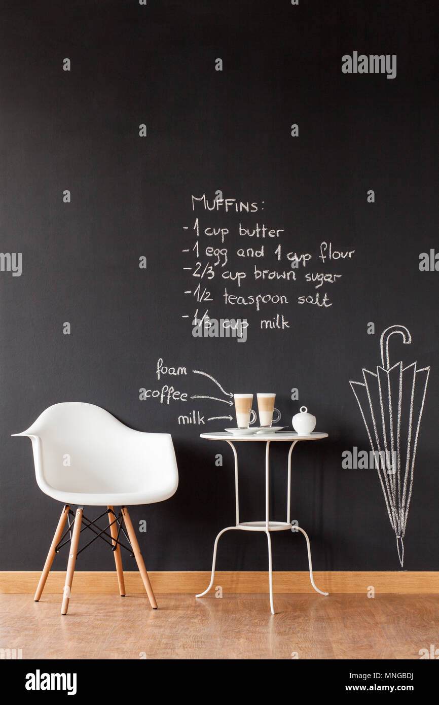 Shot of a modern room with a chalkboard wall Stock Photo - Alamy