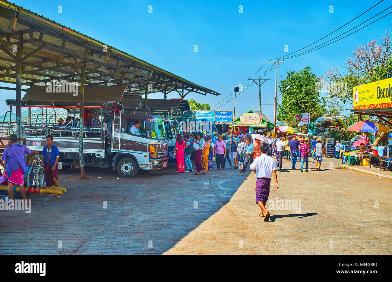 KYAIKTIYO, MYANMAR - FEBRUARY 16, 2018: The crowd at the truck station ...
