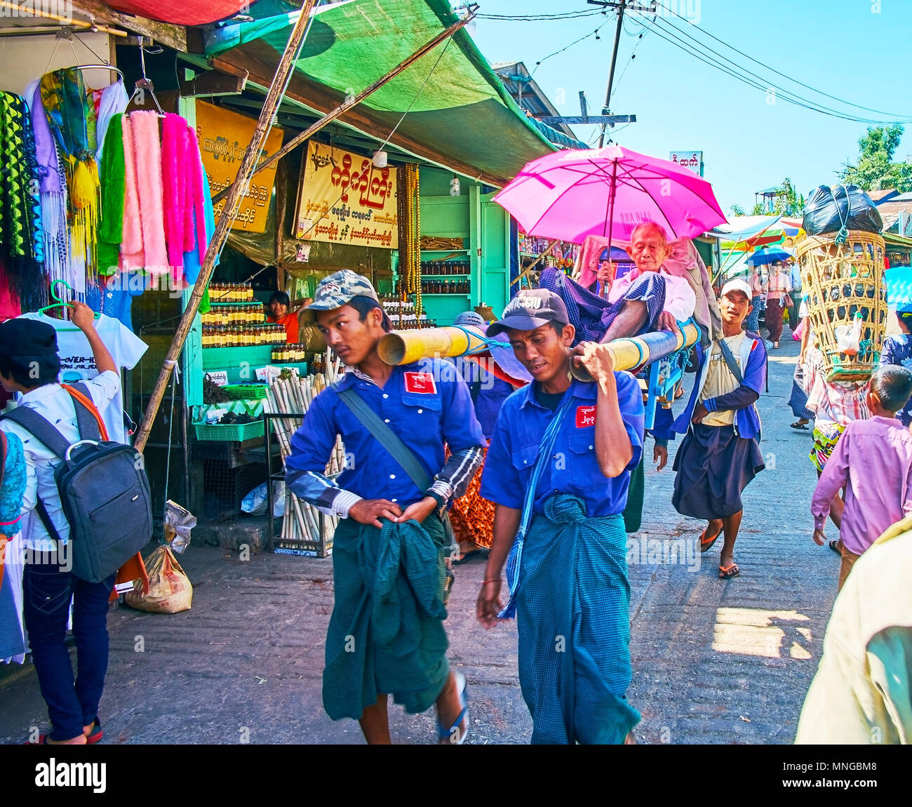 KYAIKTIYO, MYANMAR - FEBRUARY 16, 2018: The elderly pilgrims often use ...
