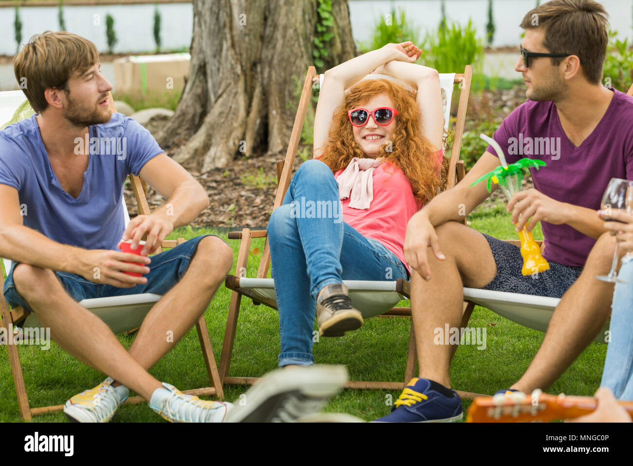 Friends Relaxing Garden High Resolution Stock Photography and Images ...