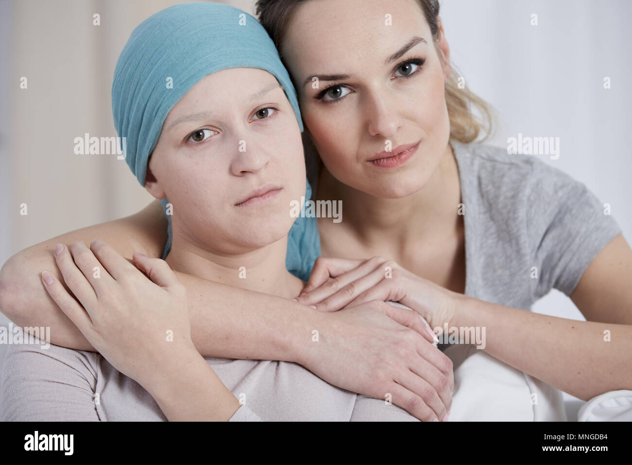 Sad cancer woman and her caring sister Stock Photo - Alamy