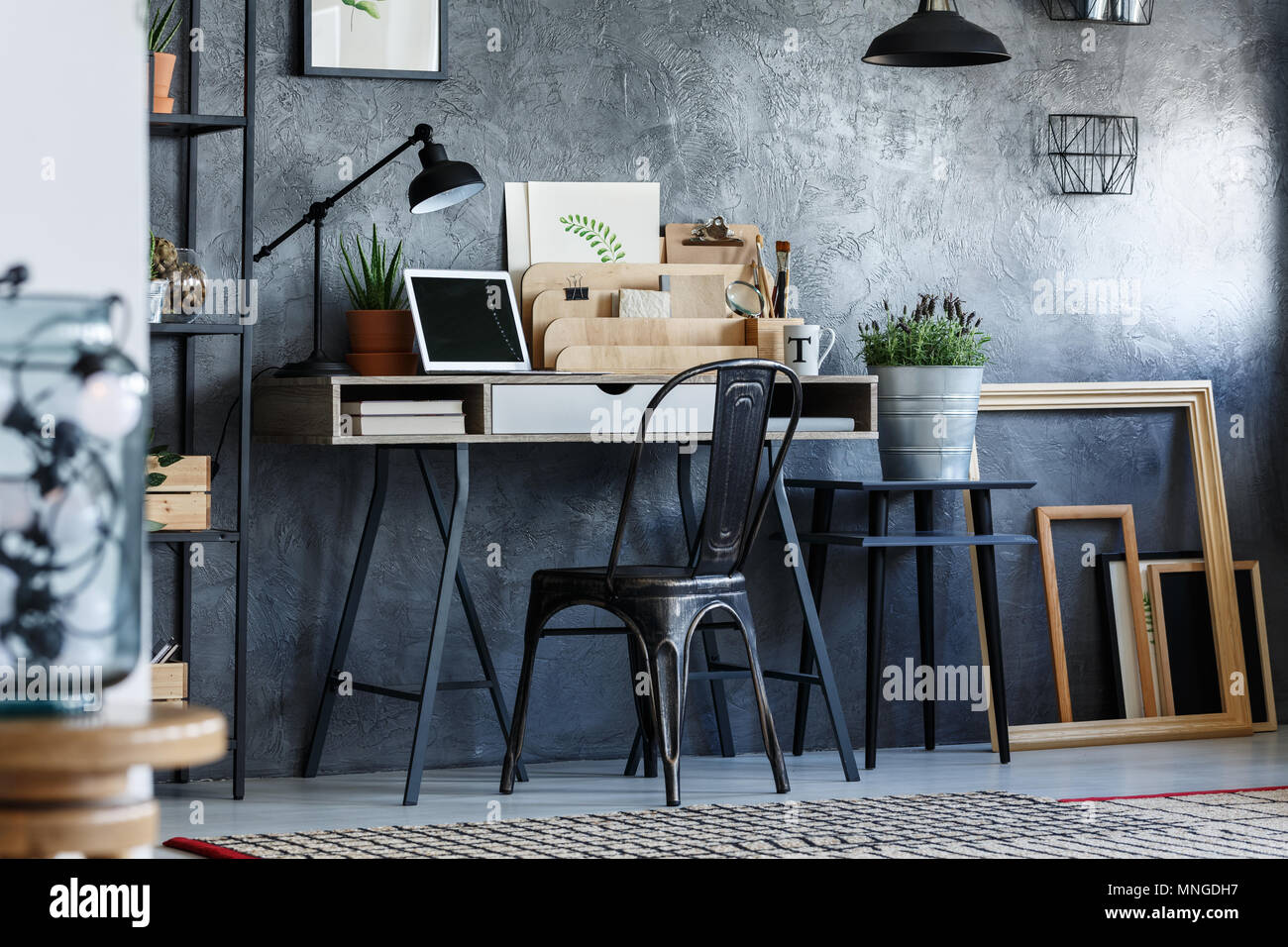 Study workspace in hipster room with dark gray textured wall Stock ...