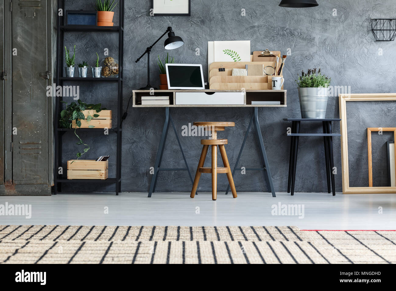 Grey wall in hipster office room with modern workspace interior Stock ...