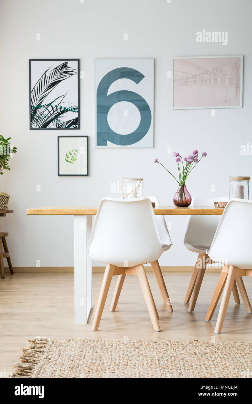 Posters hanging on the bright wall in dining room Stock Photo - Alamy
