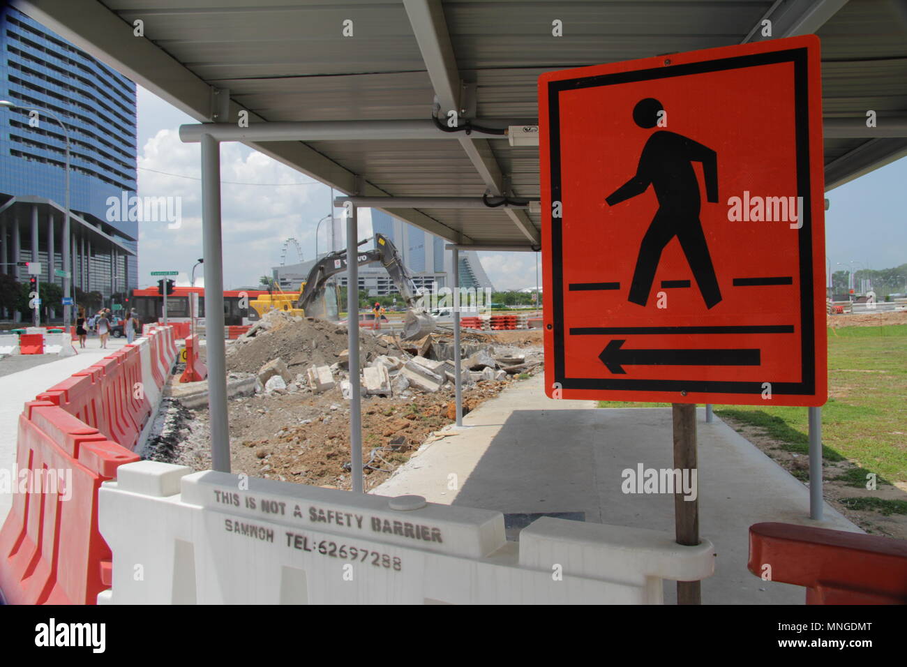 Construction Sign. Very large man on sign. Marina Bay, Singapore Stock ...
