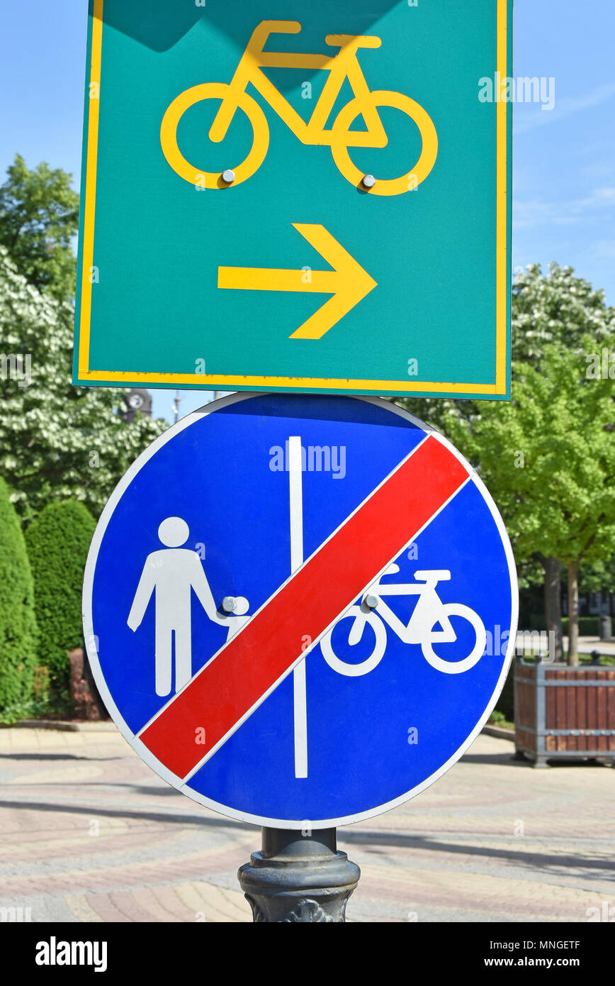 Bicycle road signs on the street in the city Stock Photo - Alamy