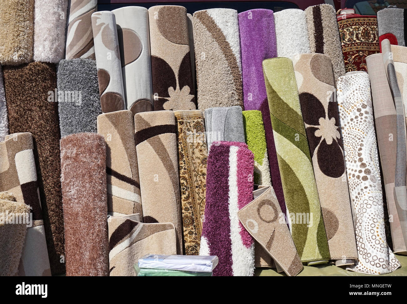 New carpets for sale on the street market Stock Photo - Alamy