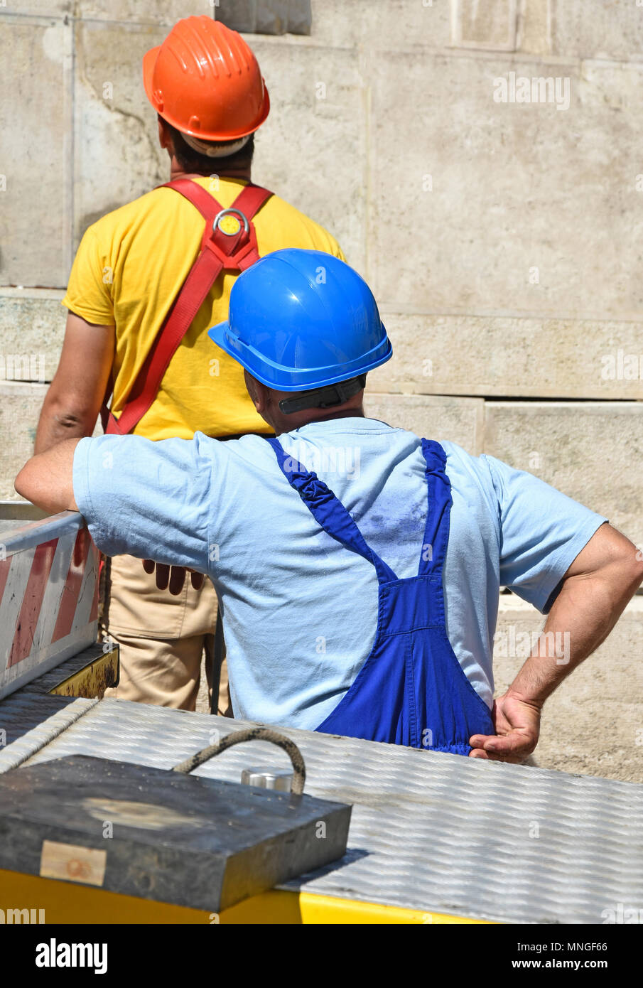 Construction workers at work outdoors Stock Photo - Alamy