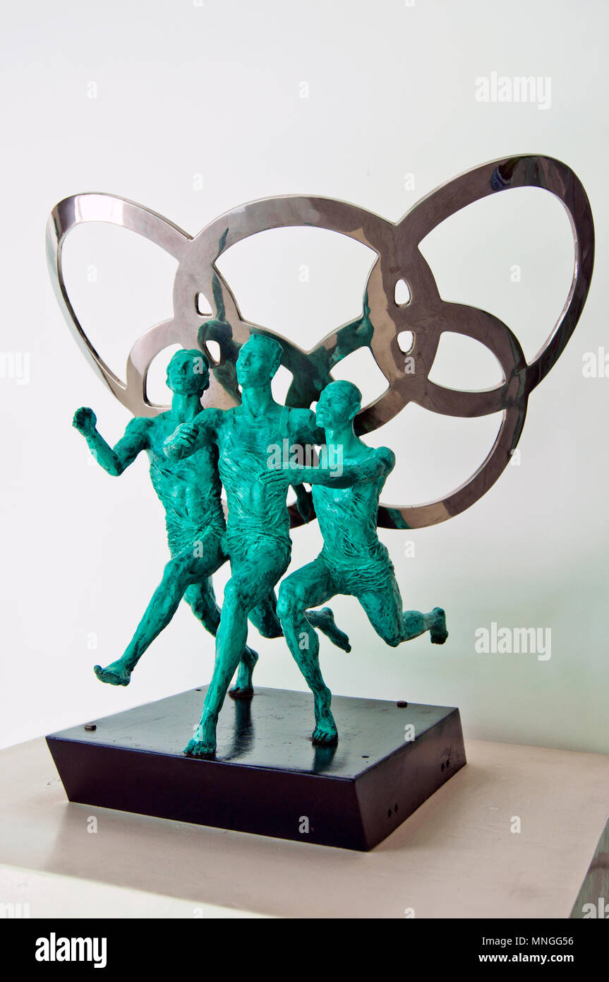 Olympic Games artwork depicting three runners in front of the Olympic ...
