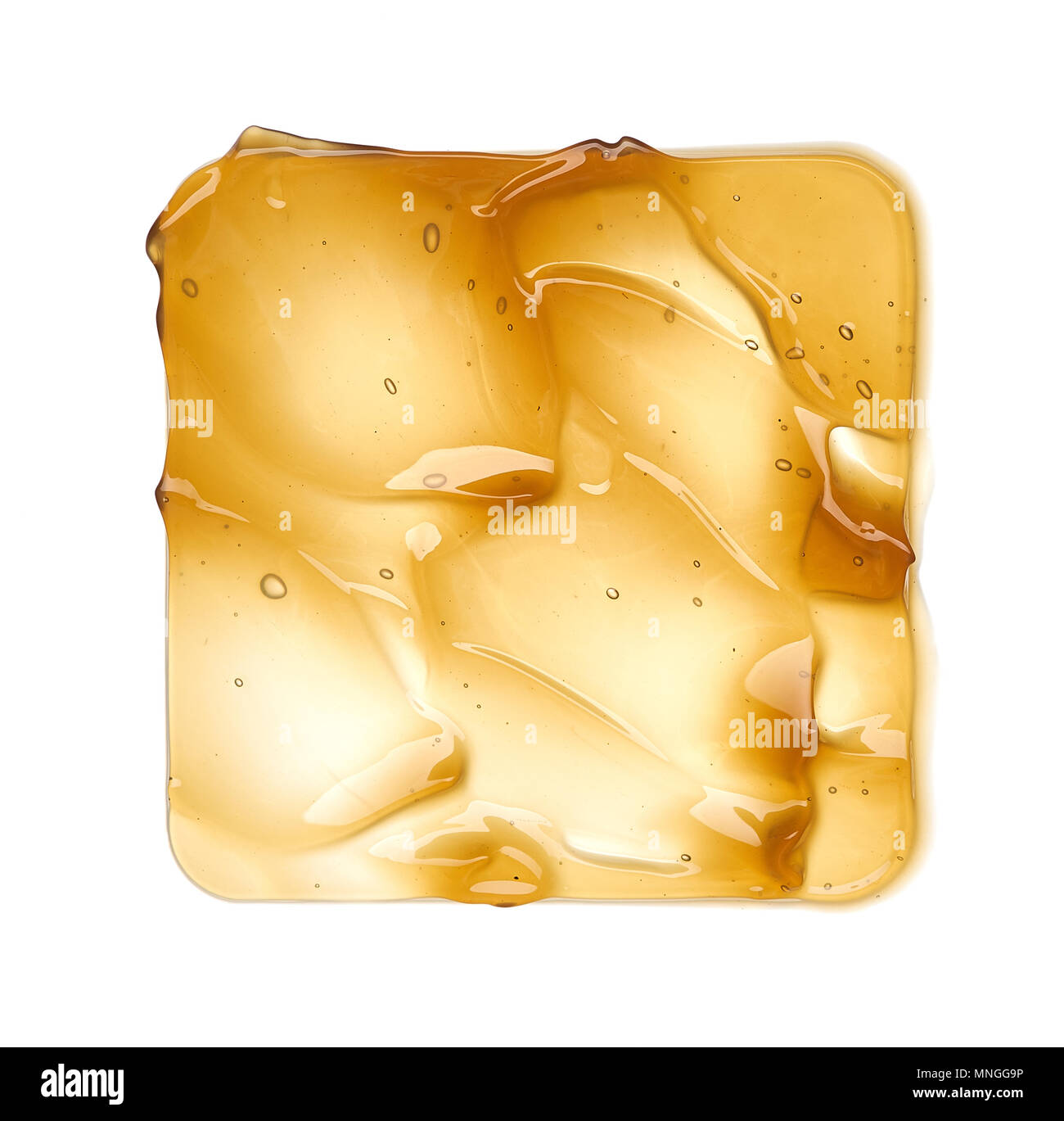 Transparent yellow smear of face cream or golden honey isolated on ...