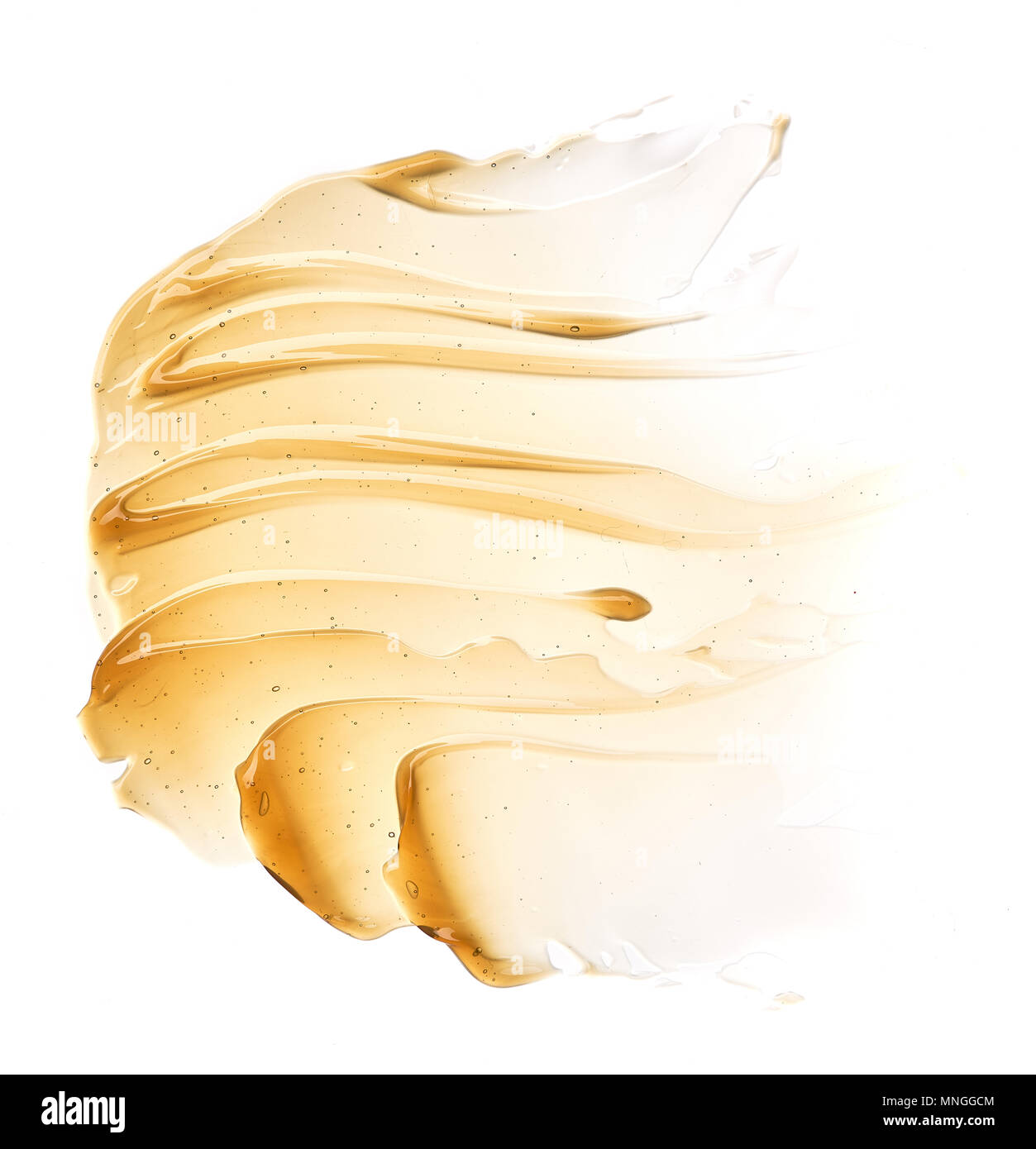 Transparent yellow smear of face cream or golden honey isolated on ...