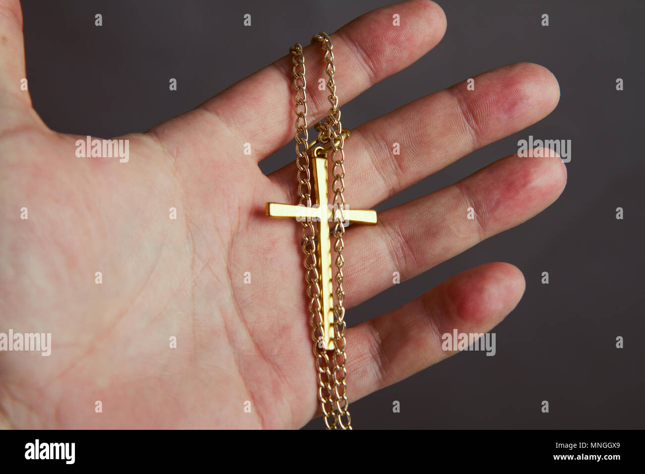Cross on a chain hi-res stock photography and images - Alamy