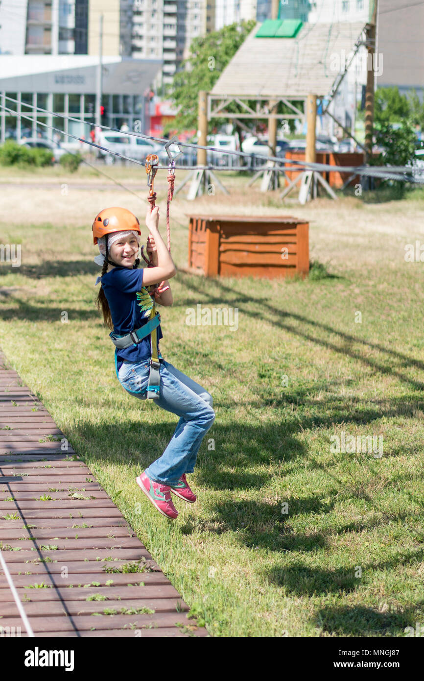 The girl is going by cable car. the girl in the cable car rides the ...