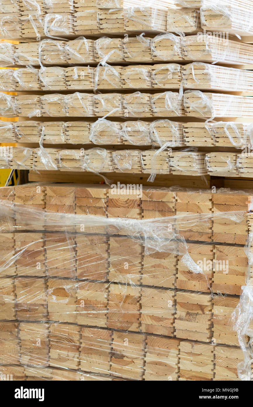 Packed boards in the building store. dry flat boards stacked together ...