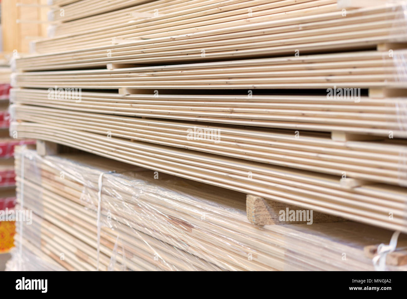 Packed boards in the building store. dry flat boards stacked together ...