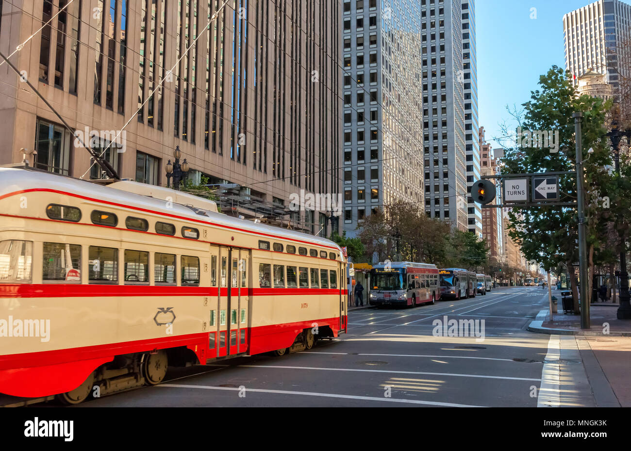 Buses and train on the street of San Francisco, California, United ...